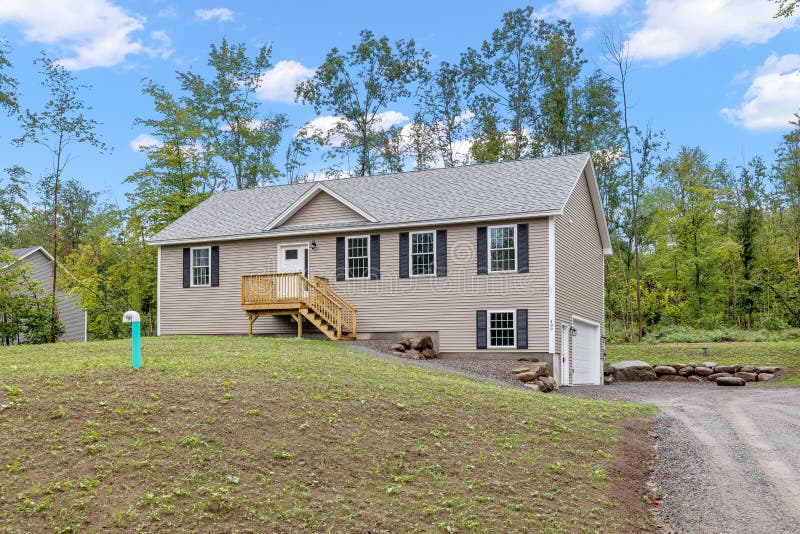 Grey Modern Construction of Contemporary Raised Ranch Surrounded by ...