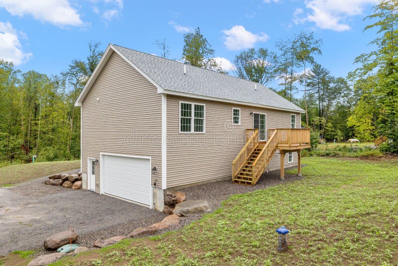 Grey Modern Construction of Contemporary Raised Ranch Surrounded by ...