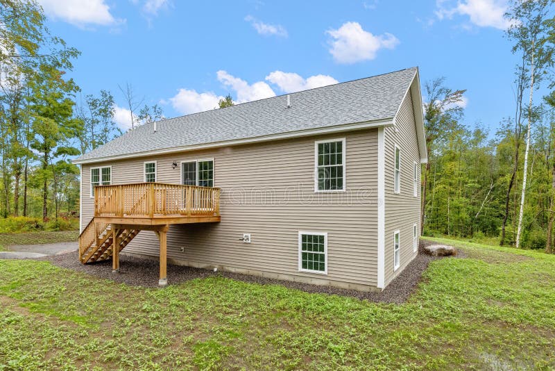 Grey Modern Construction of Contemporary Raised Ranch Surrounded by ...