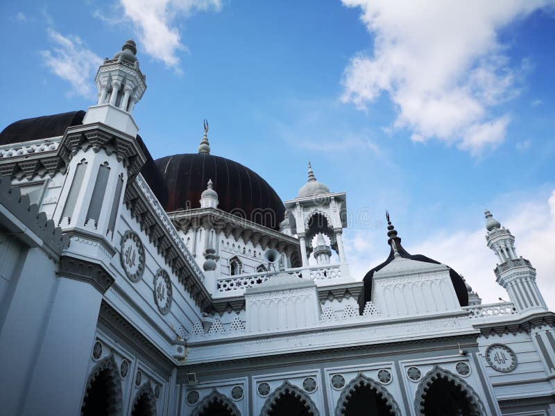 Grey mosque with blue sky. stock photo. Image of mosque - 130253078