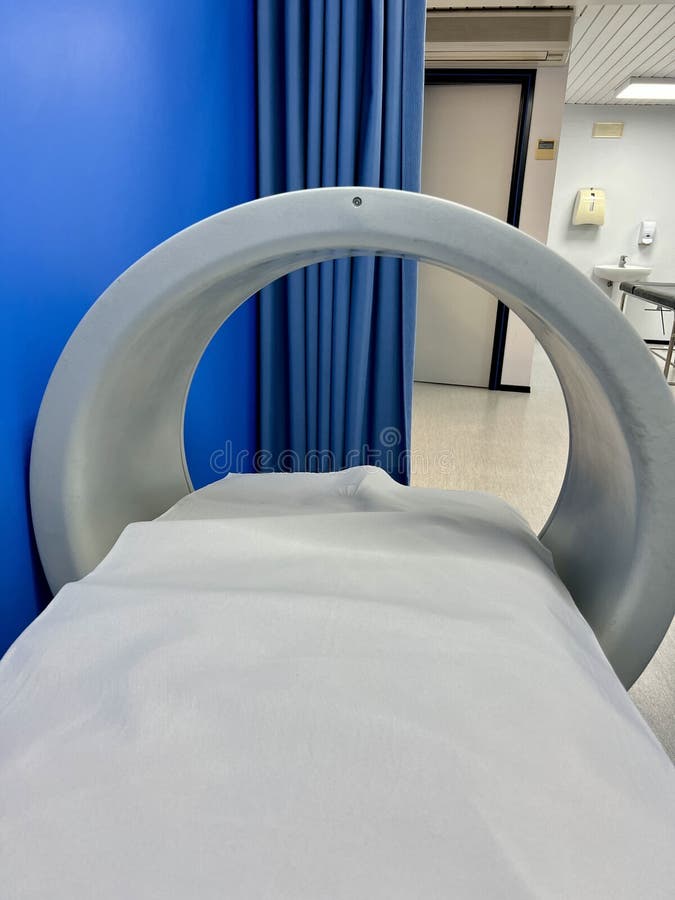 A Grey MRI Machine with a Blue Curtain Behind it Stock Image - Image of ...