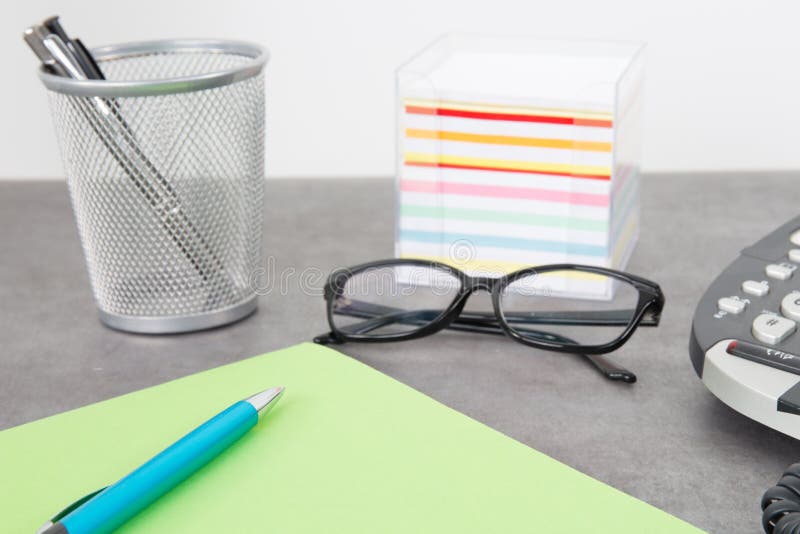 Grey Office Desk Table with a Lot of Things on it Stock Image - Image ...