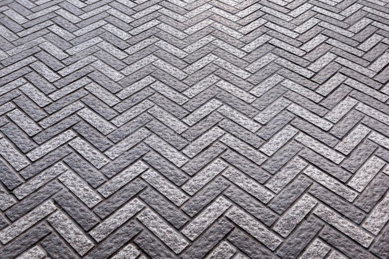 Grey Paving Slabs Made of Natural Stone Laid with a Herringbone Pattern ...