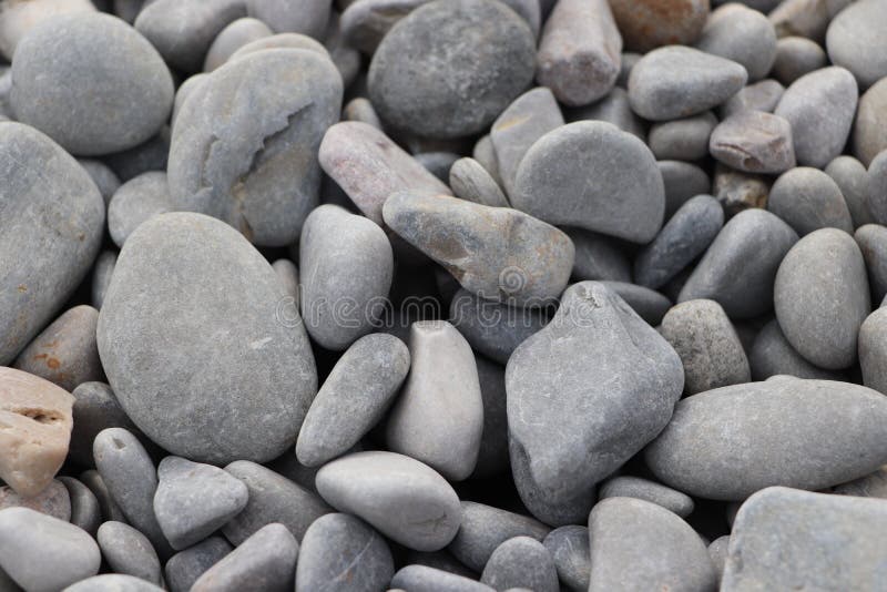 Grey pebbles on the beach stock photo. Image of mineral - 137341314