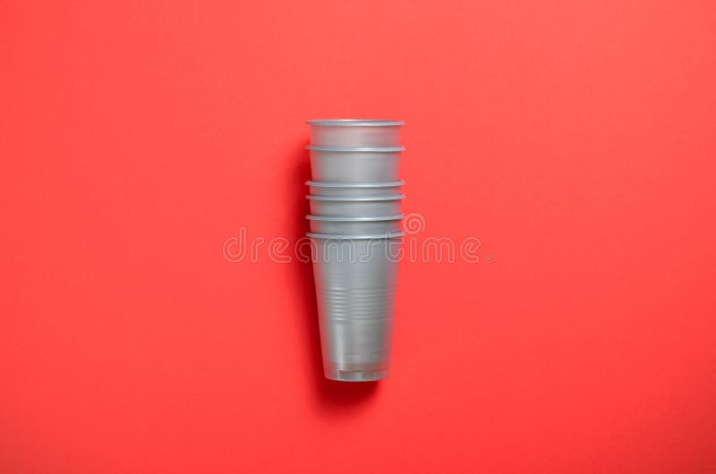 Grey Plastic Cups on Bright Orange Background, , Food Concept Stock ...