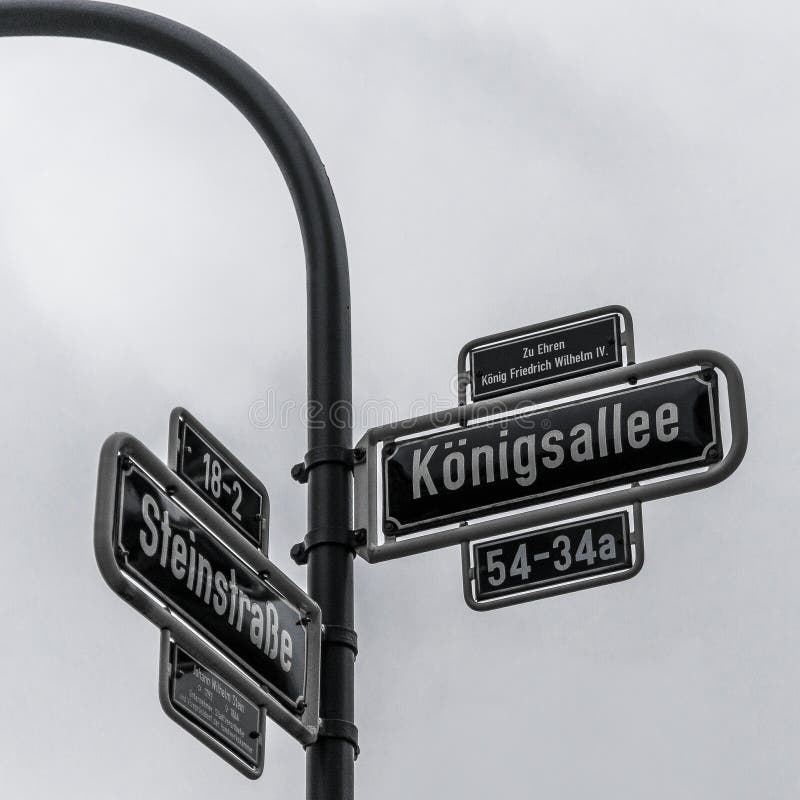 Grey Scale Low Angle Shot of Street Signs Captured in Dusseldorf ...