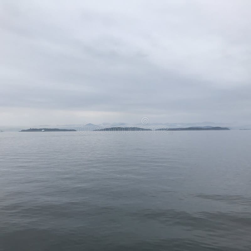 Grey sea meets grey sky stock photo. Image of color - 155153070