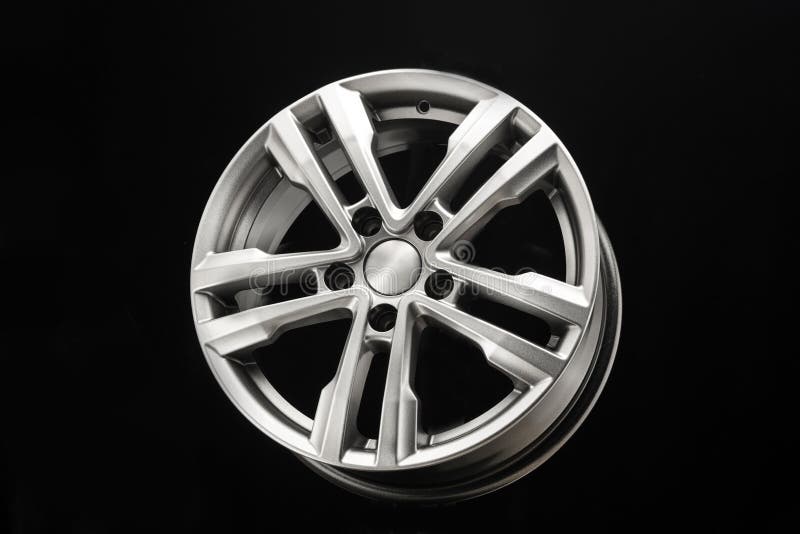 New Alloy Wheel of the Car, Close-up on a Black Background, Wheel ...