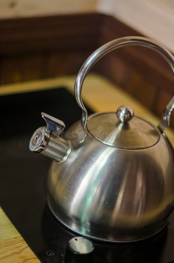 Grey Stainless Kettle with Whistle on the Induction Cooktop in the ...