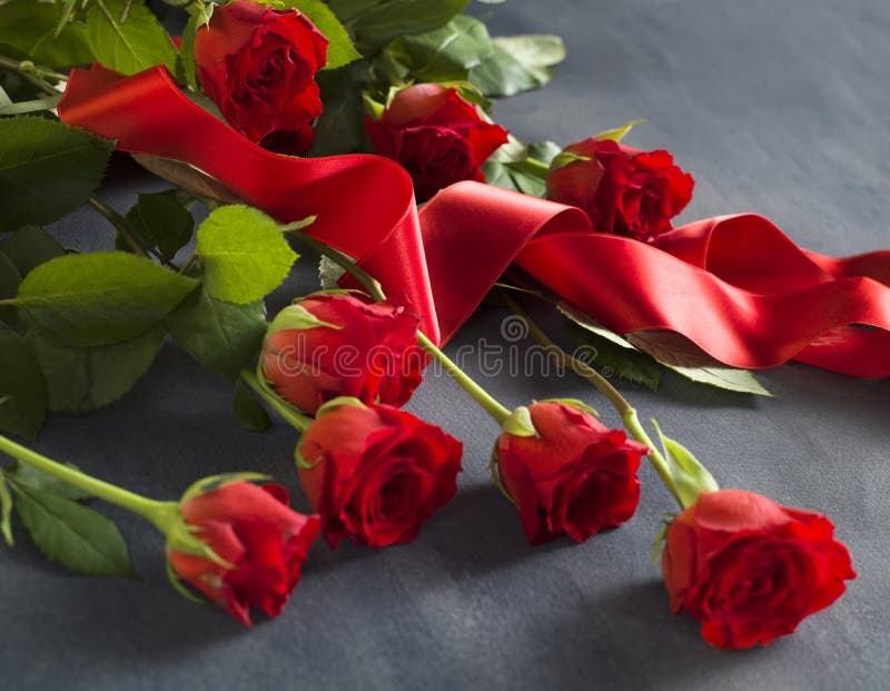 Grey Stone with a Bunch of Red Roses Stock Photo - Image of loss, love ...