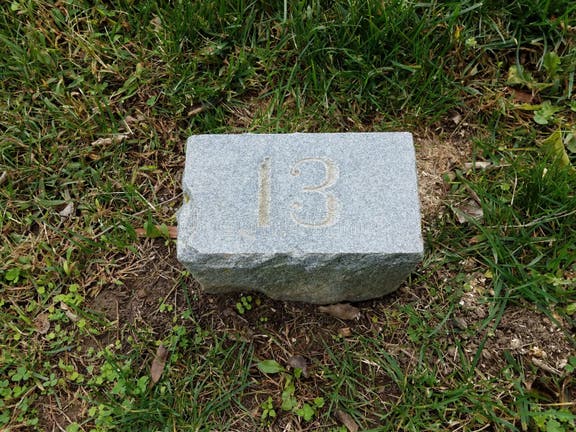 Grey Stone with Number Thirteen in Grass Stock Photo - Image of green ...