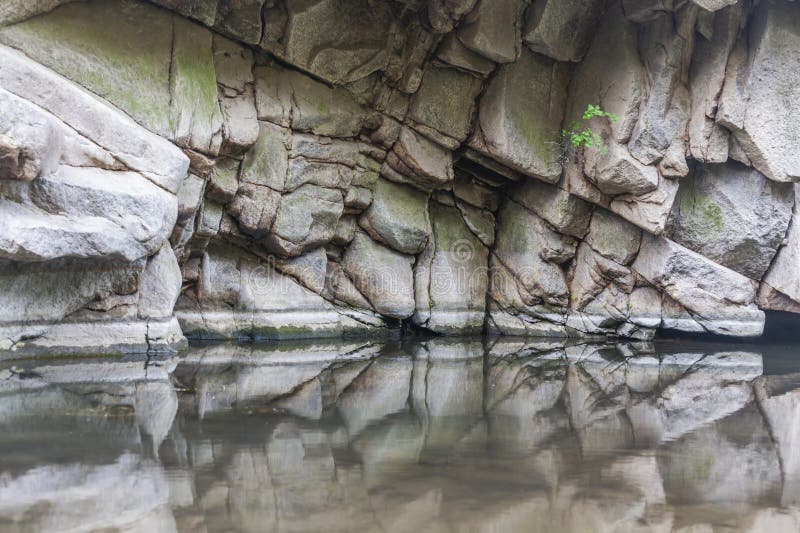 Stone Walls by the Water and Reflections in the Water Stock Photo ...