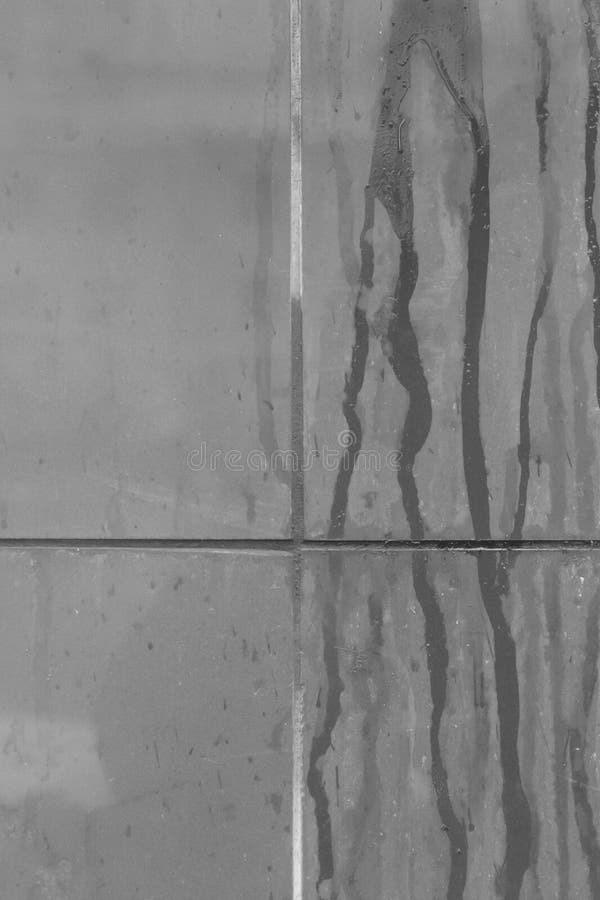 Grey Streaks of Paint Spilled on the Surface of Ceramic Tiles Wall ...