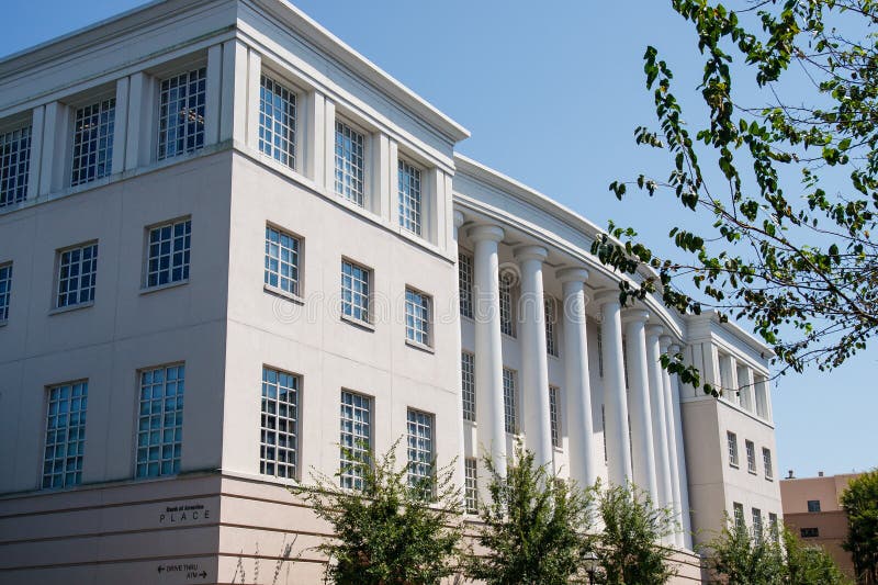 Grey Stucco Building with White Columns Stock Image - Image of wall ...