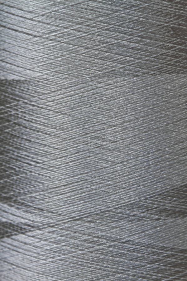 Grey thread in spool stock photo. Image of yarn, strand - 20690864
