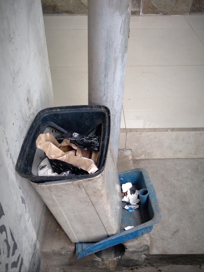 A Grey Trash Can Filled with Trash Shot from the Top Left Side Stock ...