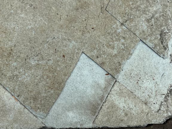 A Grey and White Tile Floor with a Few Pieces Missing Stock Photo ...