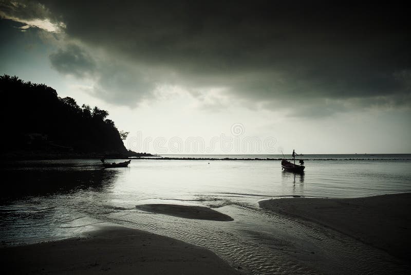 Greyscale of a Beach Surrounded by the Beach and Greenery with Boats on ...