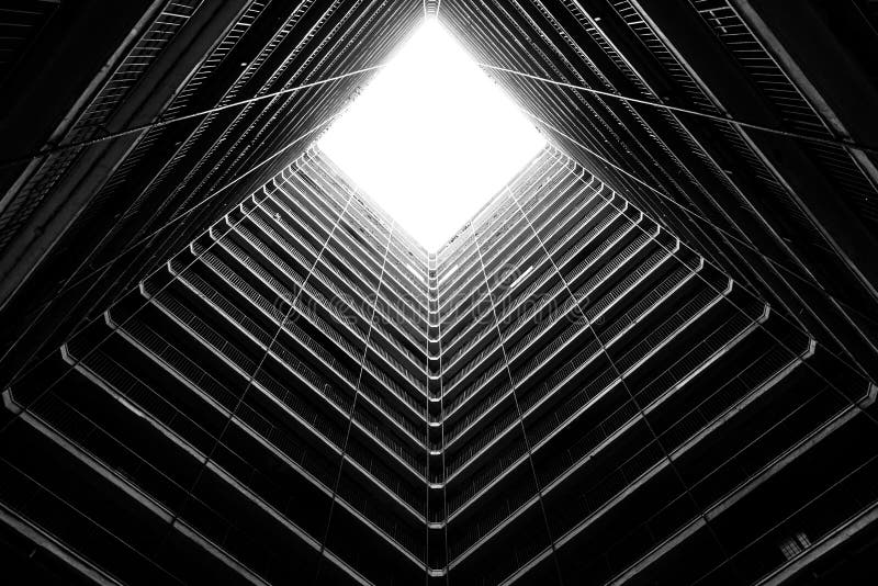 Greyscale Low Angle Shot of the Light Coming in through the Ceiling of ...