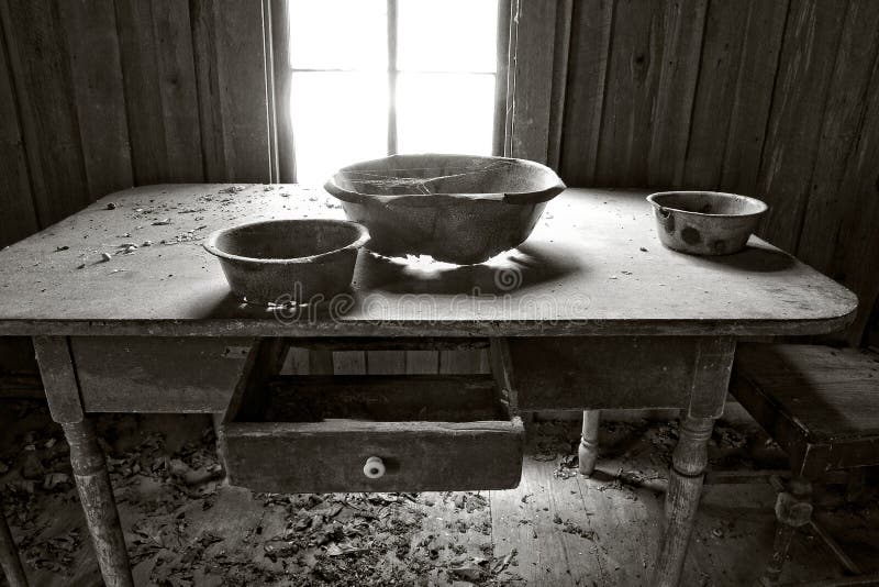 Greyscale of an Old Dusty Table with Bowls on it in an Abandoned ...