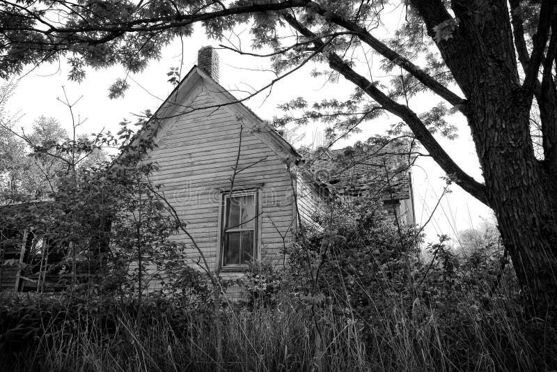 Greyscale of an Old Farmhouse Surrounded by Trees and Grass Under a ...