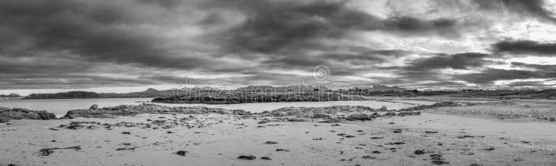 Greyscale Panoramic Shot of the Dark Clouds Covering the Beach Stock ...