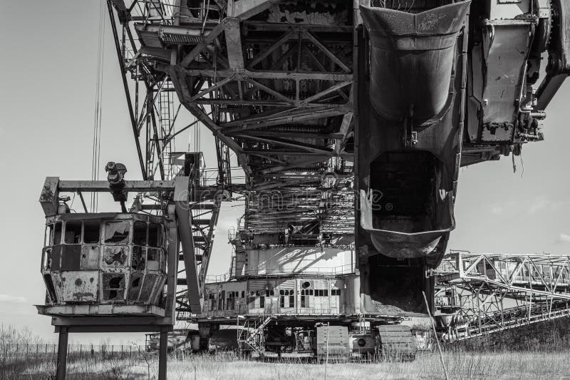 Greyscale of a Rusty Old Excavator with Rust and a Clear Blue Sky in ...