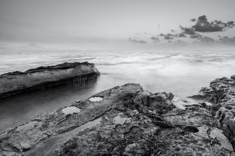 Greyscale Shot of the Beach Covered in Mist Stock Image - Image of ...
