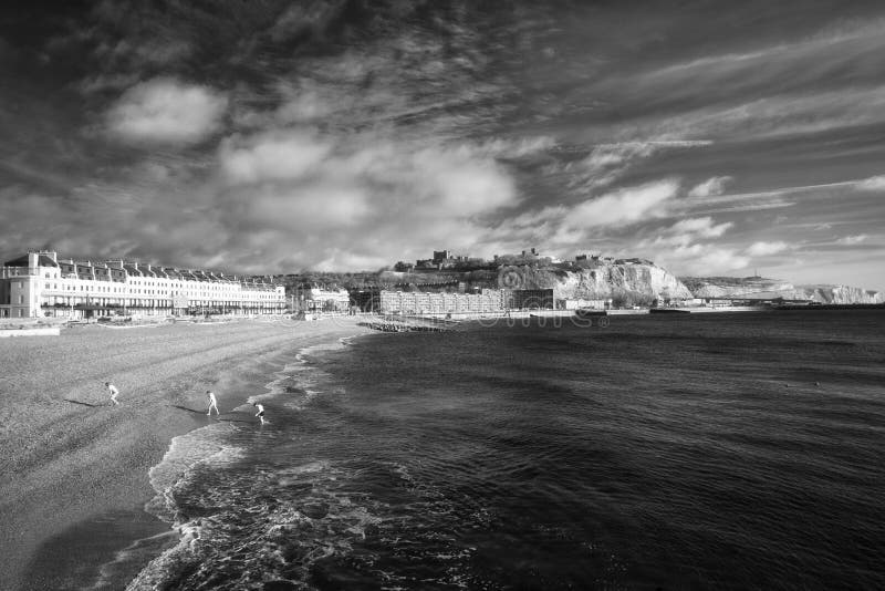 Greyscale Shot of a Beach Resort with Kids Playing on the Shore Stock ...