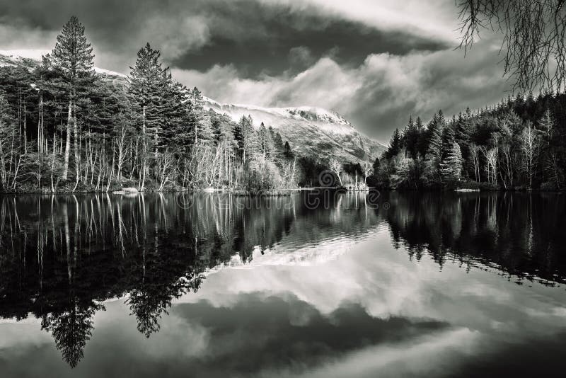 Greyscale Shot of a Clear Lake with the Mountain and Clouds Reflection ...