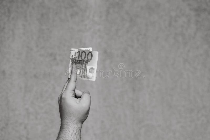 Greyscale Shot of a Man& X27;s Hand Holding Money Stock Photo - Image ...