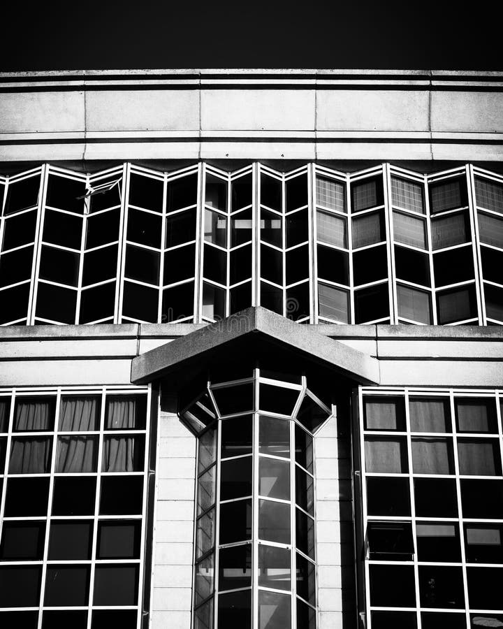 Greyscale Shot of a Modern Building with Glass Wall Stock Image - Image ...
