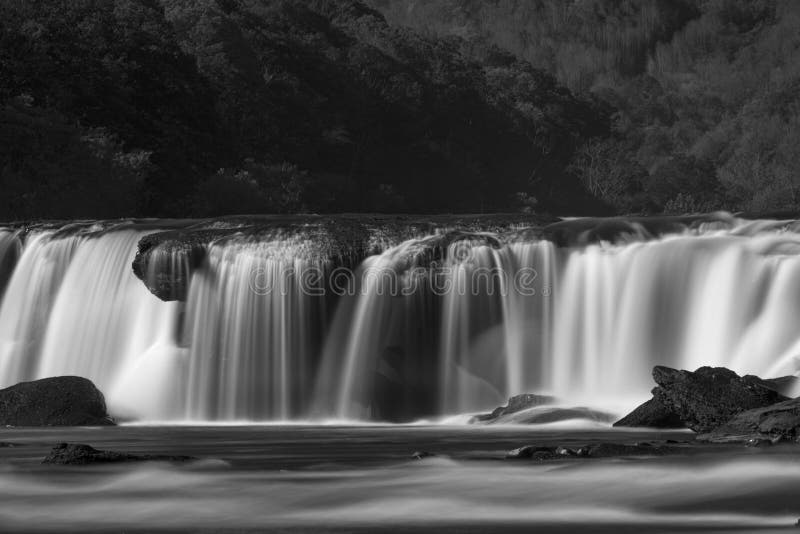 Greyscale Shot of a Small Foamy Waterfall on the Rocks Stock Photo ...