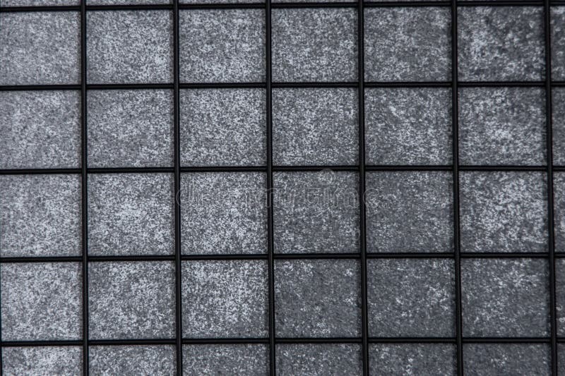 Grid Pattern of Gray Textured Tiles on an Indoor Wall in a Modern ...