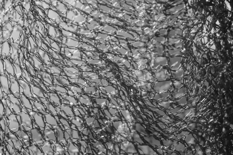 A Grid of Threads As a Background on Light and Shadow Close-up Black ...