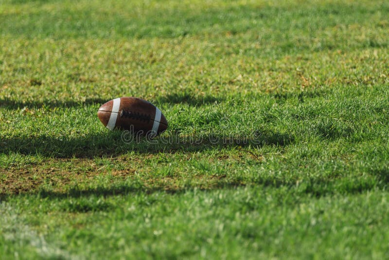 Gridiron Ball, Also Called a Pigskin, on the Green Grass. Stock Photo ...