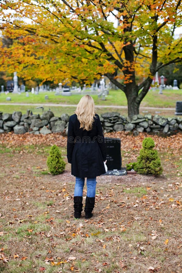 Woman Mourning at Cemetery stock image. Image of graveyard - 2404973