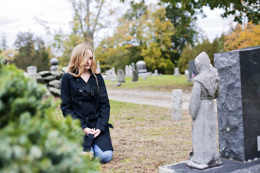 Grieving woman in cemetery stock image. Image of morning - 21881449