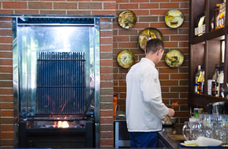 Grill in bar and cook back editorial photo. Image of background - 147308201