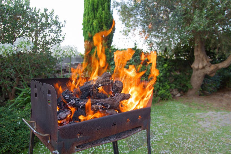 Grill for Barbecue with Flame in Open Space of Backyard Stock Photo ...