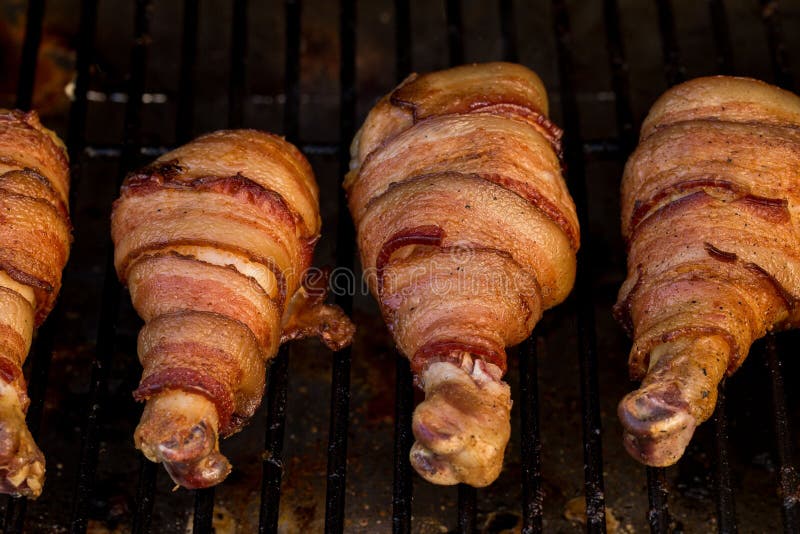 Grill with Chicken Legs Wrapped with Bacon Stock Image - Image of sauce ...