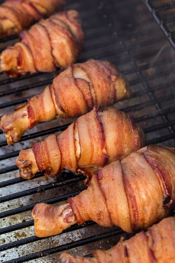 Grill with Chicken Legs Wrapped with Bacon Stock Photo - Image of ...