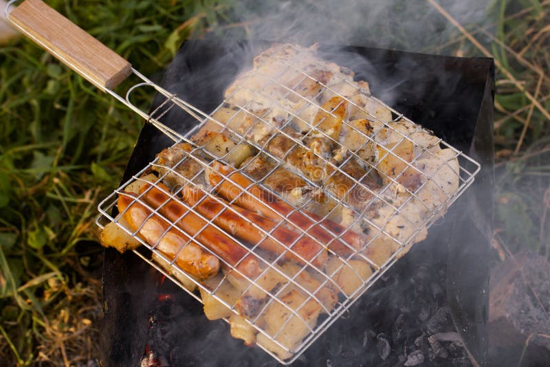 Grill Installed on the Lawn in the Park. it Has Meat on the Grill Rack ...