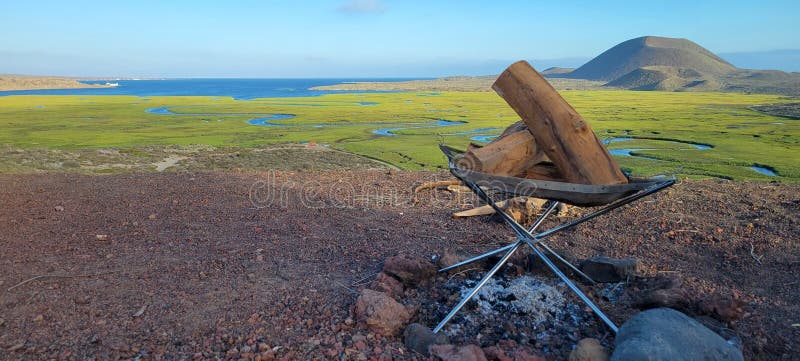 Grill with a Log with the Ocean in the Background Stock Photo - Image ...