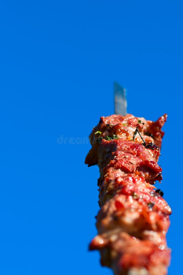 Grill meat over blue sky stock image. Image of food, marinated - 34975615