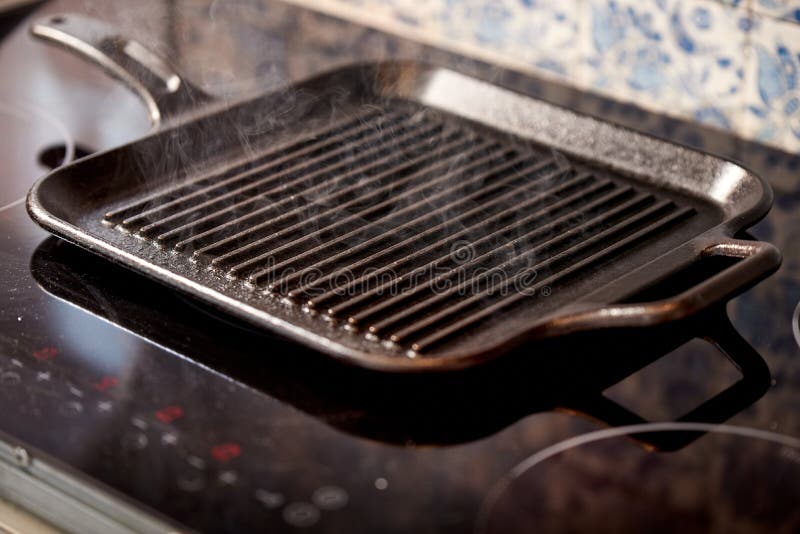The Grill Pan is Hot on the Stove and is Steaming Stock Image - Image ...