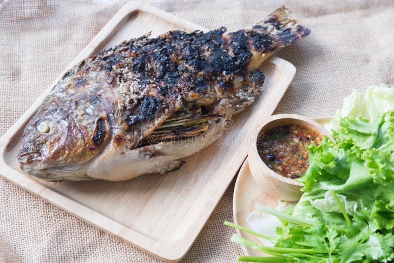 Grill Salt Tilapia Fish with Vegetable and Spicy Sauce Stock Photo ...