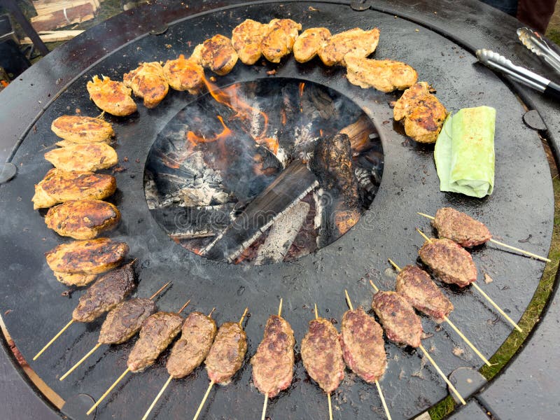 A Grill with Skewers of Meat and Vegetables on it Stock Photo - Image ...