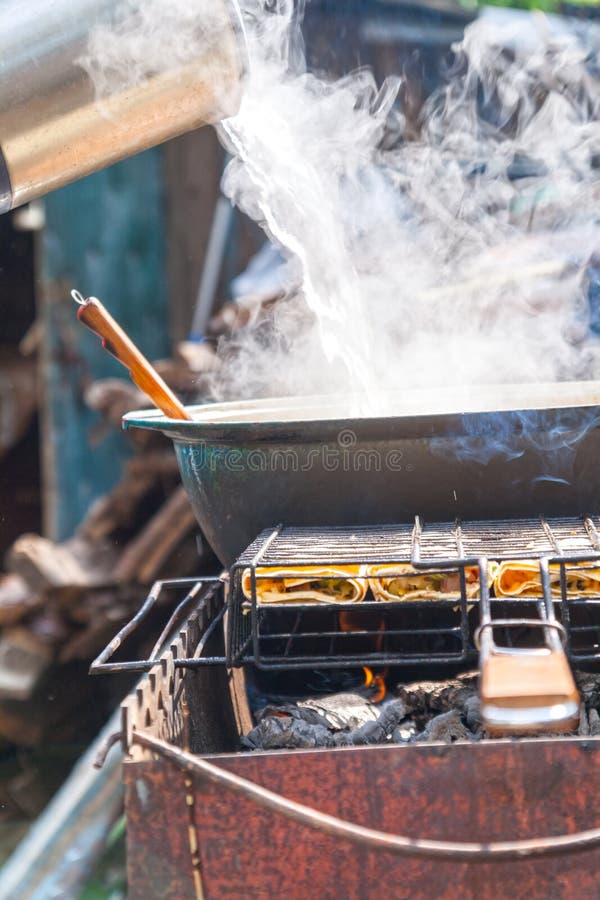 On the Grill Stands a Cauldron in Which To Prepare Meat and Vege Stock ...