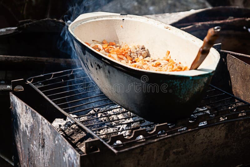 On the Grill Stands a Cauldron in Which To Prepare Meat and Vege Stock ...
